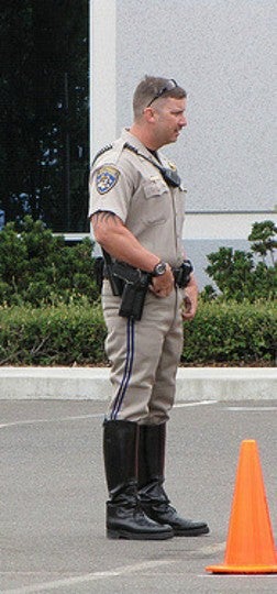 Cop in tall balck boots. by dajohnson | BeFunky Photo Editor